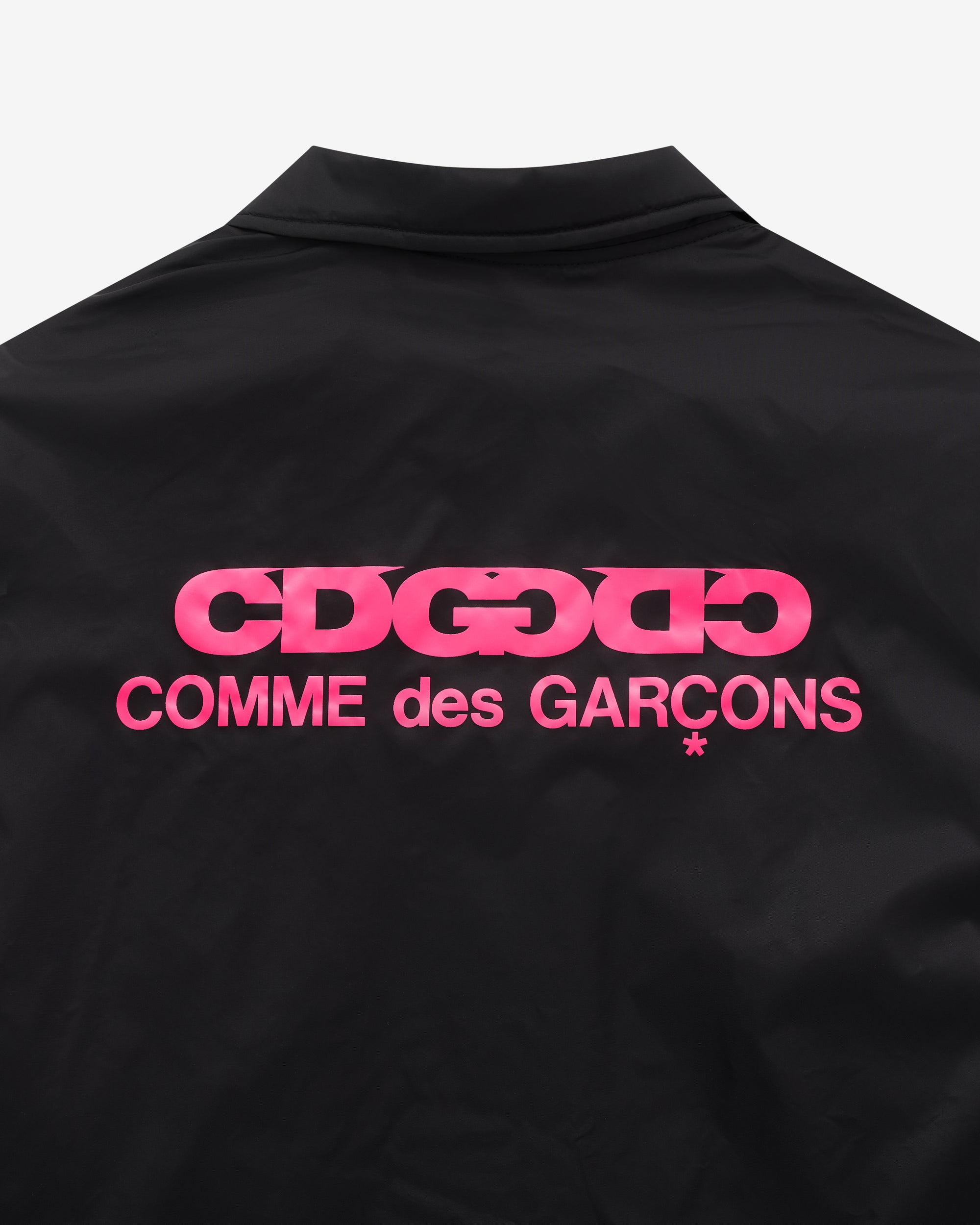 CDG: Pink Logo Coach Jacket (Black) | DSMNY E-SHOP